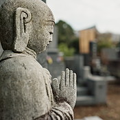 Garden statue in traditional Japanese graveyard with peace, calm and ...