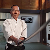 Aikido, katana and master fight with a sword in traditional Japanese ...