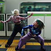 Women, dancing and station for train, travel and art with futuristic ...