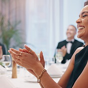 Woman, laughing with applause and support at event, praise and respect ...