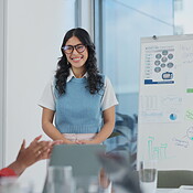 Business meeting, applause and presentation with charts for success ...