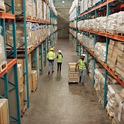 Warehouse, shipping and delivery people walking in a distribution ...
