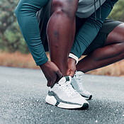 Fitness, ankle and hands rub injury, accident or pain at race ...