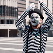Mime, art and man in city with paint on face for performance, action ...