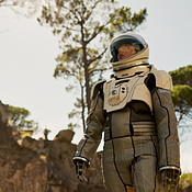 Planet, travel and astronaut walking in forest to explore abandoned ...