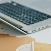 Laptop, coffee and spill with mistake, accident and office problem on ...