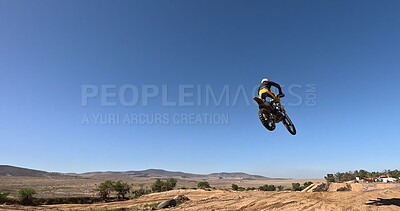 Blue Sky, male person and motorcycle jump with low angle for ...
