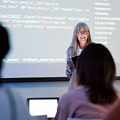 Female teacher, coding and screen in class for education with html ...