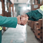 Closeup, handshake and people in warehouse, teamwork and logistics with ...