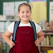 Smile, face and child in classroom for education, learning and ready ...
