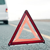 Car, road and warning triangle for accident, vehicle breakdown or ...