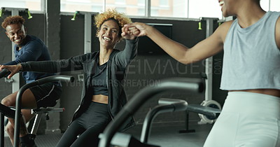 Fitness, women and fist bump for exercise bike challenge at gym with ...