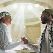 Muslim, men and handshake with hug in mosque for greeting, respect and ...