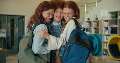 High school, students and happy girls hug for meeting, greeting and ...