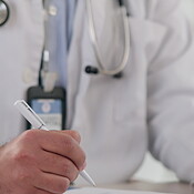 Doctor, hands and writing on document in hospital for healthcare ...