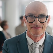 Face, ceo or mature man with pride in office, leadership and management ...