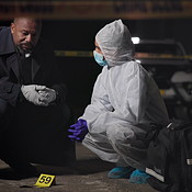 Crime scene, detective and forensic team in discussion with evidence ...