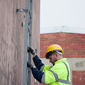 Man, engineer and site with industrial, ladder and inspection as ...