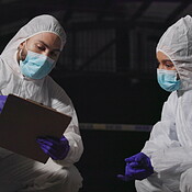 Forensic, team and documents with evidence at crime scene for ...