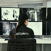 Security guard, surveillance and person in office, screen and watch of ...