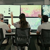 People, control room and group monitor weather pattern on satellite ...