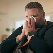 Sick, sneeze and man with tissue, allergies and sickness for cold ...