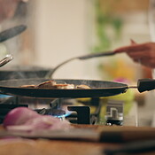 Hands, cooking and shaking of pan, recipe and meal preparation for ...