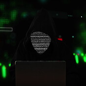 Coding, hacker and laptop for download data for illegal transfer, binary code and programming ...