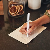 Home, hands and person with paper for grocery list, planning and ...