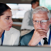 Cybersecurity, man and woman at computer in control room planning ...