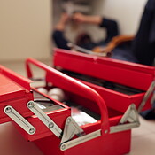 House, plumber and person with toolbox on floor for pipeline ...