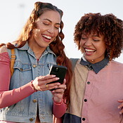 Phone, social media and laughing with women in city for networking ...