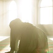 Bowing, faith and religion with woman in Mosque to worship Allah for ...
