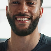 Face, man and fitness with sweating, smile and happy from exercise and ...