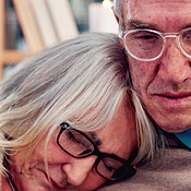 Sad, crying and senior coupe in home with cancer news, comfort and ...