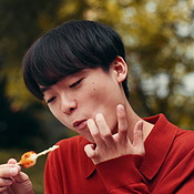 Japanese man, snack and eating street food for travel, holiday and wipe ...