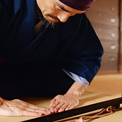 Prayer, sword and martial arts sensei in dojo for practice routine ...