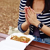 Woman, praying and hands in park with food, noodles and picnic bench in ...