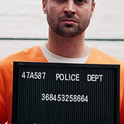 Criminal, police station and man with mugshot, arrest and thief with ...