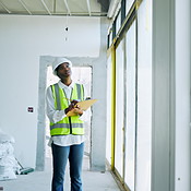 Black woman, civil engineer or checking with clipboard for construction ...