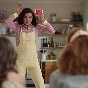 Clues, game or mime with woman and friends in living room of home for ...