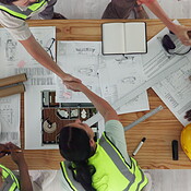 Team, people and construction with handshake, engineering and floor ...