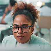 Developer, face and woman on computer for reading research, project or ...