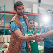 Happy, man and volunteer with handshake for donation agreement, welcome ...