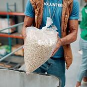 Hands, food drive and teamwork with volunteer people packing donations ...