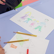 Teacher, hands and drawing with child at school for elementary lesson ...