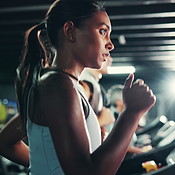 Woman, breathing and run on treadmill in gym for fitness, endurance and ...