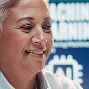 Happy, mature woman and programmer with smile, machine learning and ...