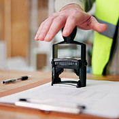 Clipboard, hands and stamp with logistics employee in warehouse for ...