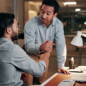 Investing, night and people with handshake in office, computer and ...